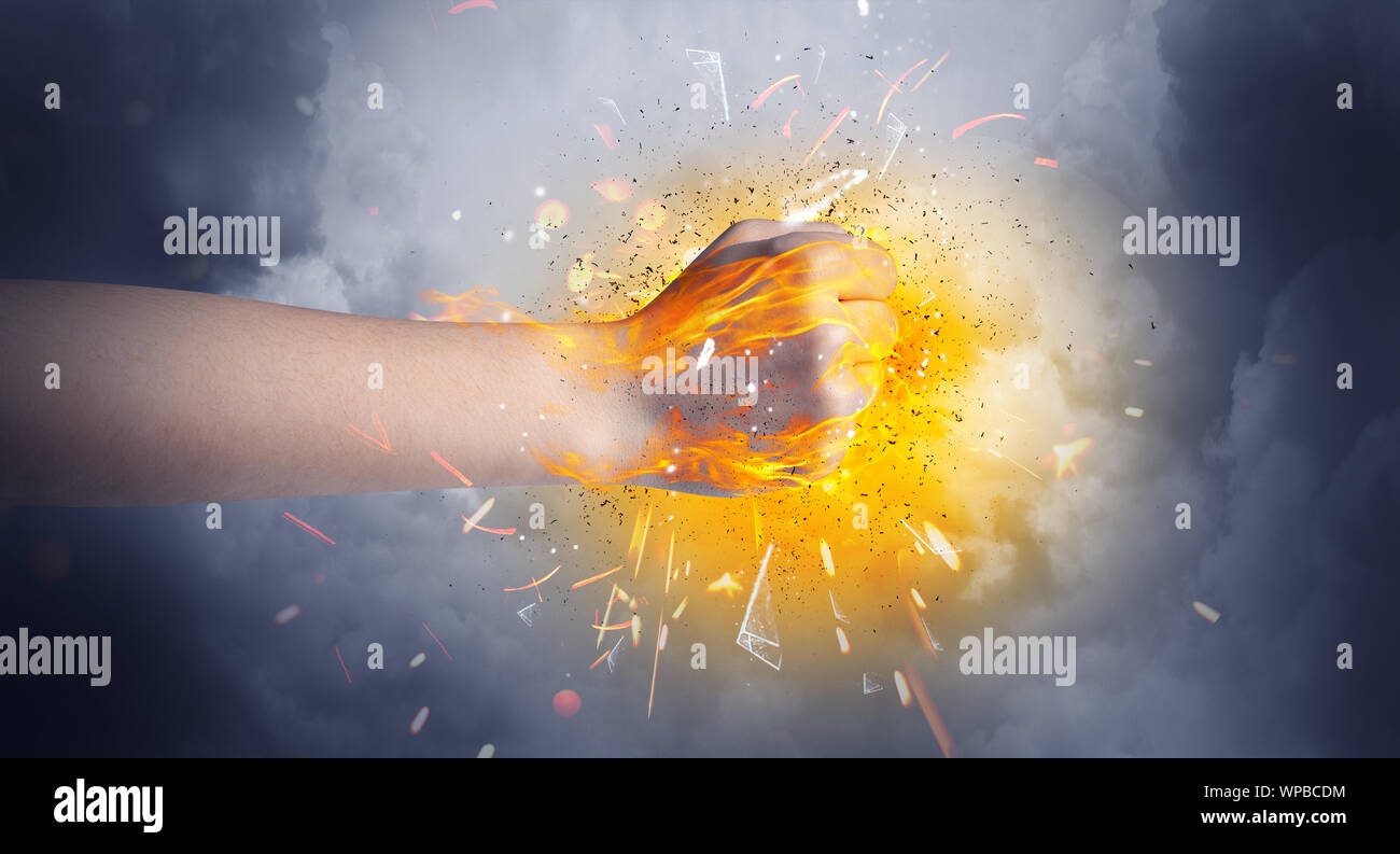 Hand hits strongly and makes fire beam around Stock Photo - Alamy