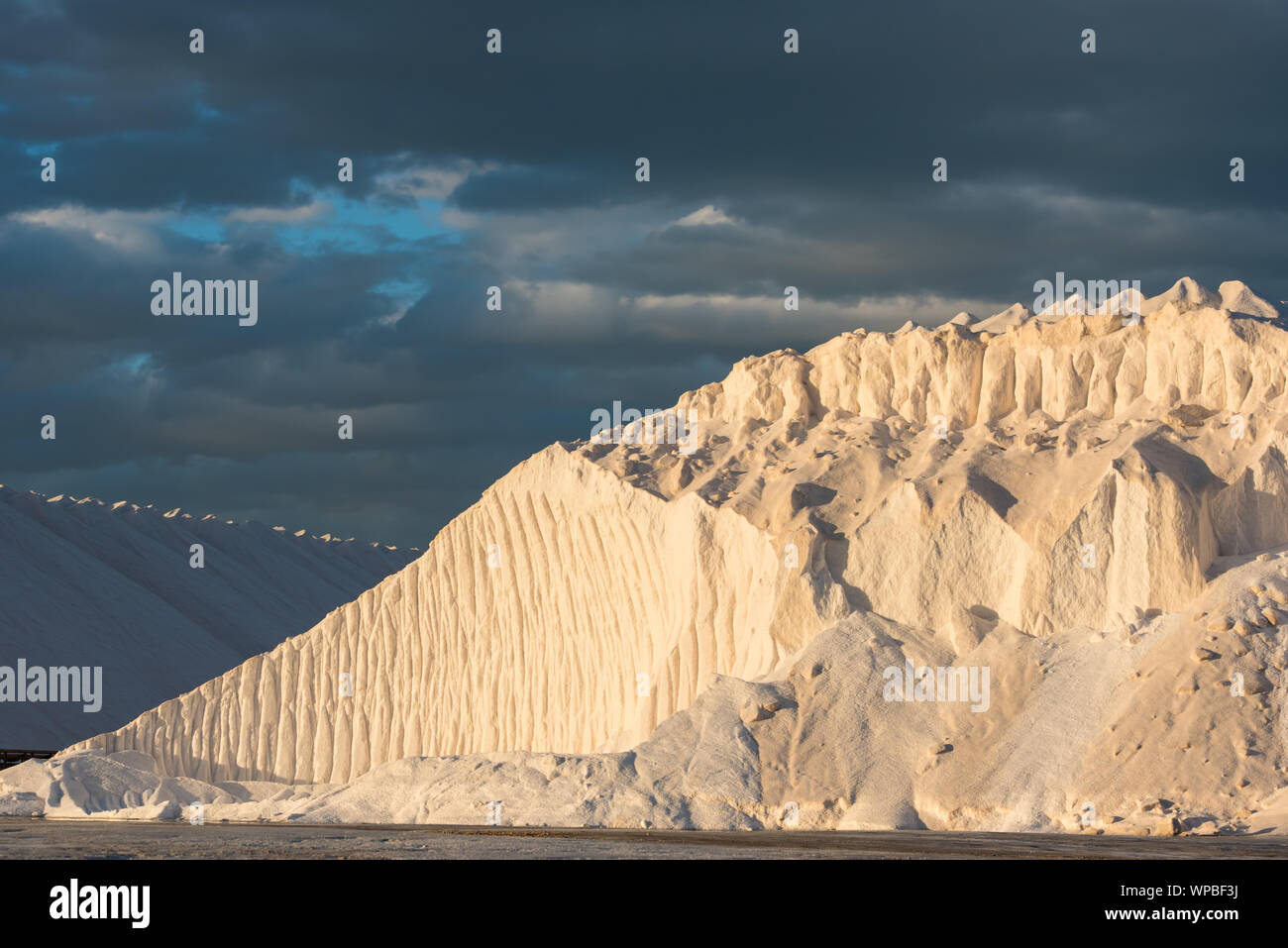 hill of pure salt in afternoon sun Stock Photo - Alamy