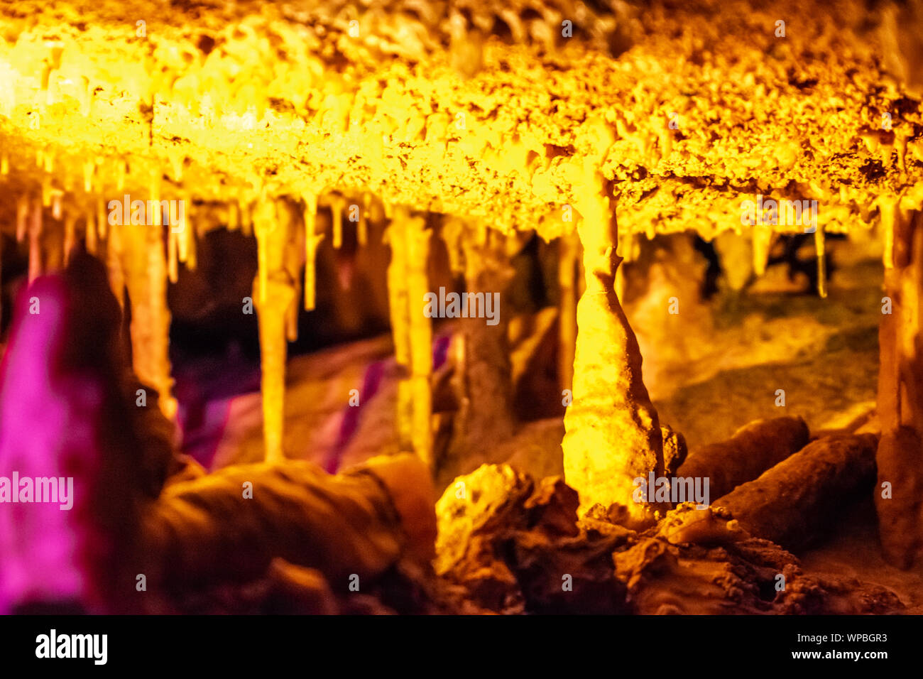 Formations of stalactites and stalagmites in a cave Stock Photo - Alamy