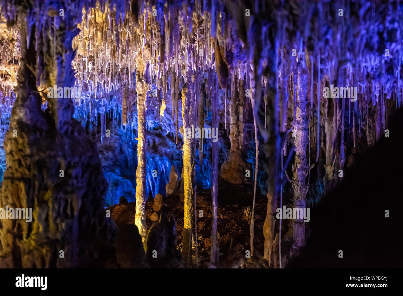 Formations of stalactites and stalagmites in a cave Stock Photo - Alamy