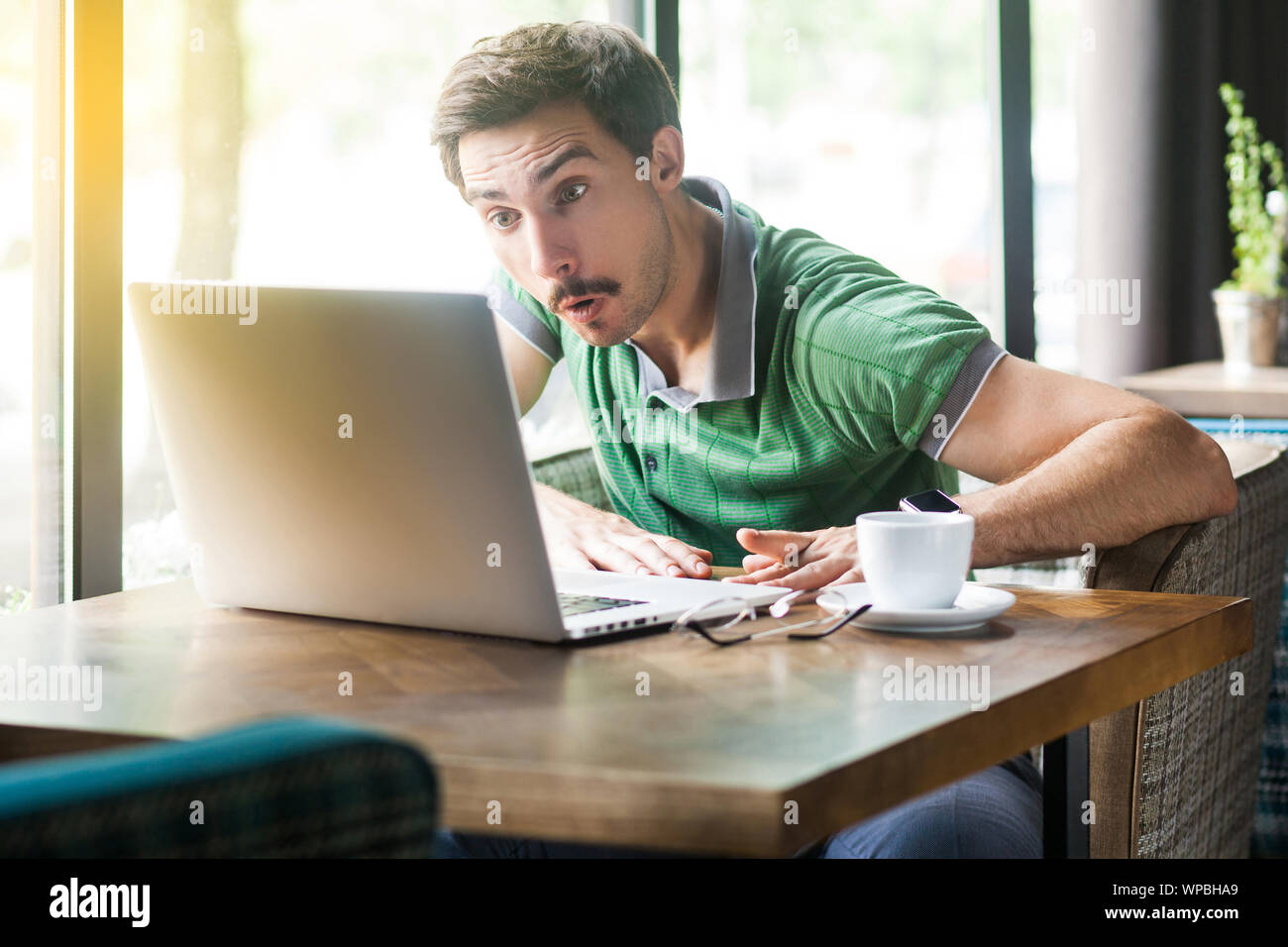 Shocked man in disbelief sitting hi-res stock photography and images ...
