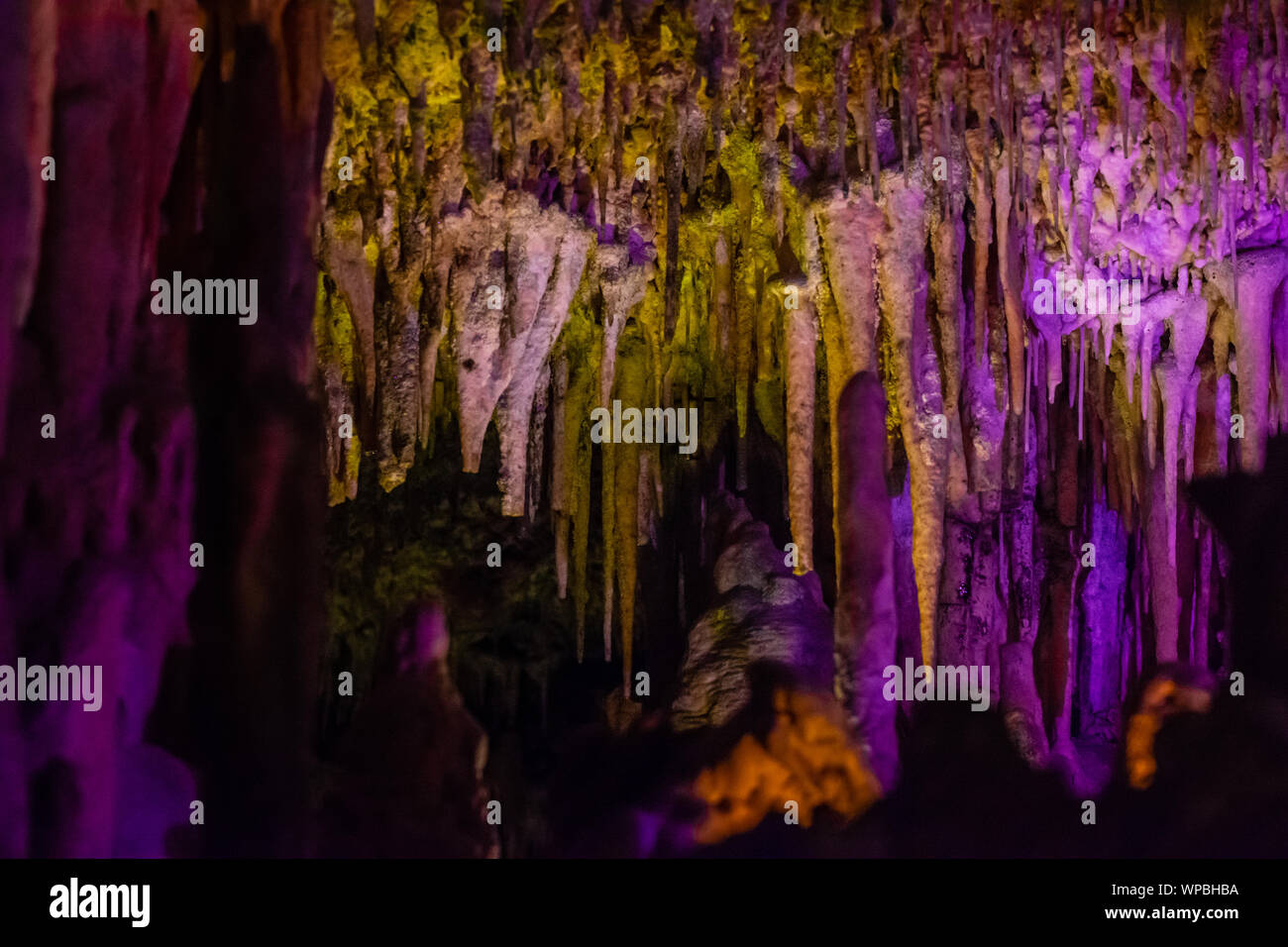 Formations of stalactites and stalagmites in a cave Stock Photo - Alamy