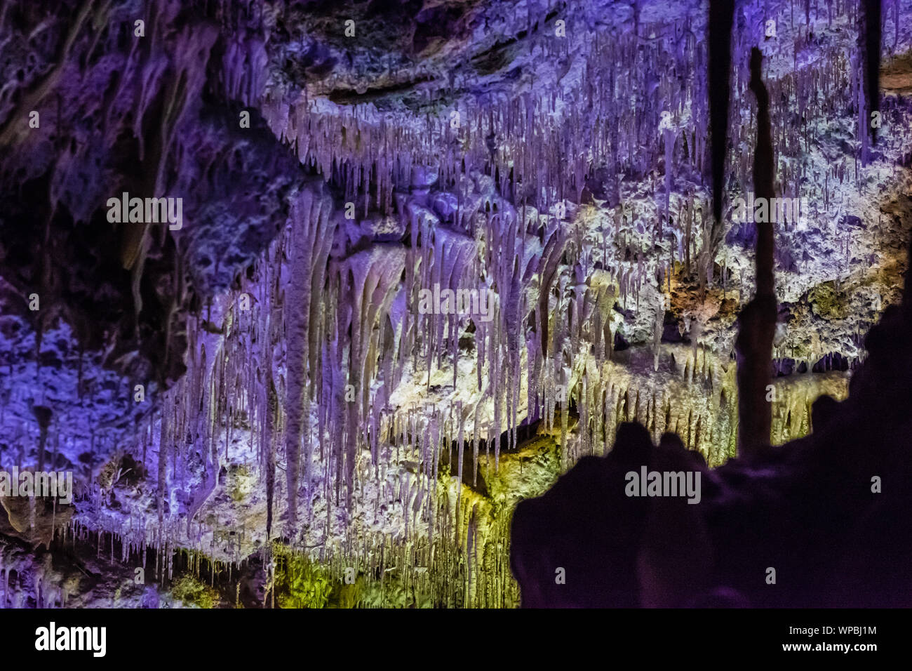 Formations of stalactites and stalagmites in a cave Stock Photo - Alamy