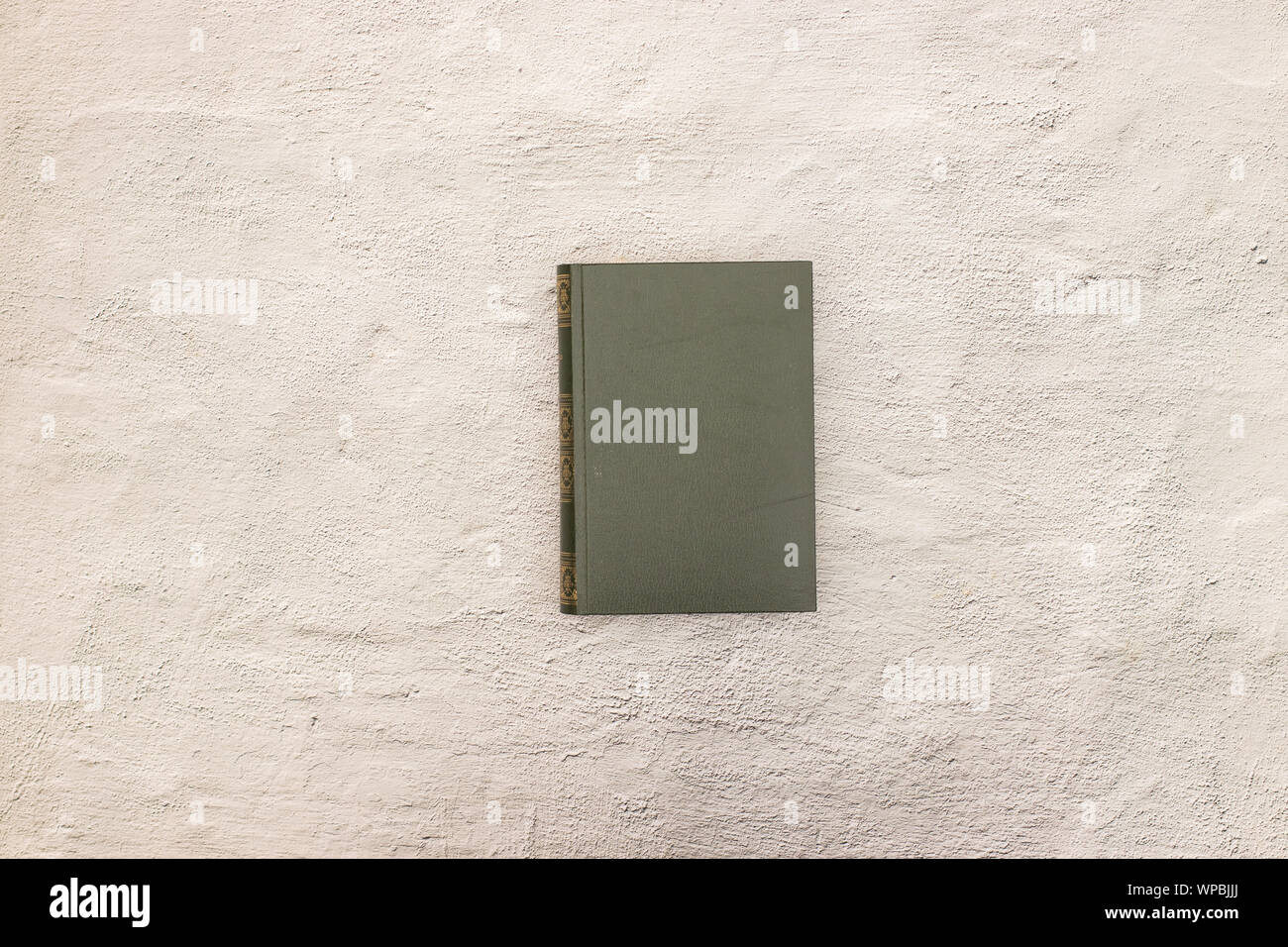 One colored book on the table for reading Stock Photo - Alamy