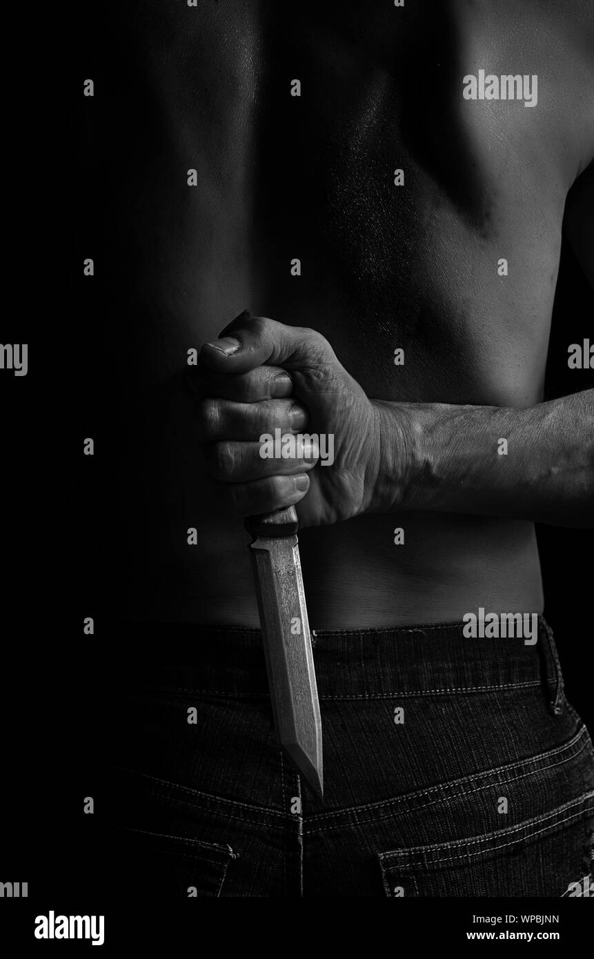 Hiding knife hi-res stock photography and images - Alamy