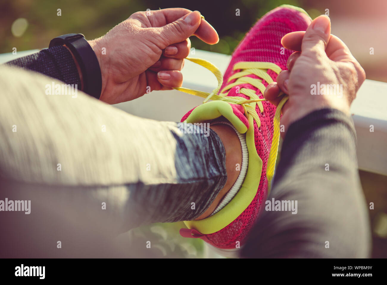 Women tying running shoes Stock Photo - Alamy