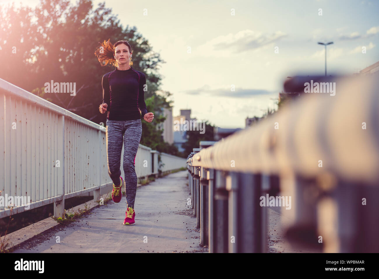 Women running hi-res stock photography and images - Alamy