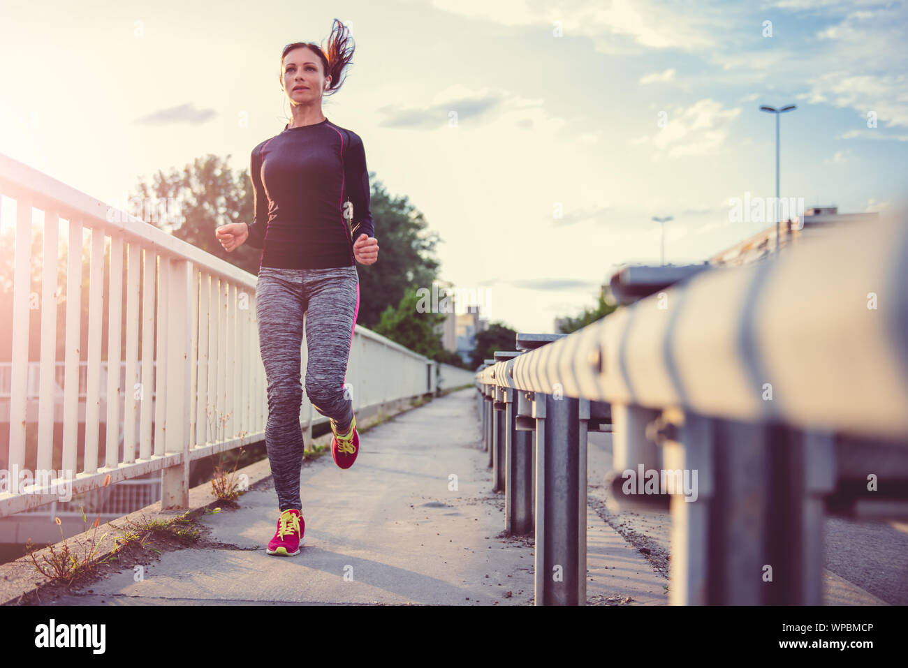 Women running in the city Stock Photo - Alamy