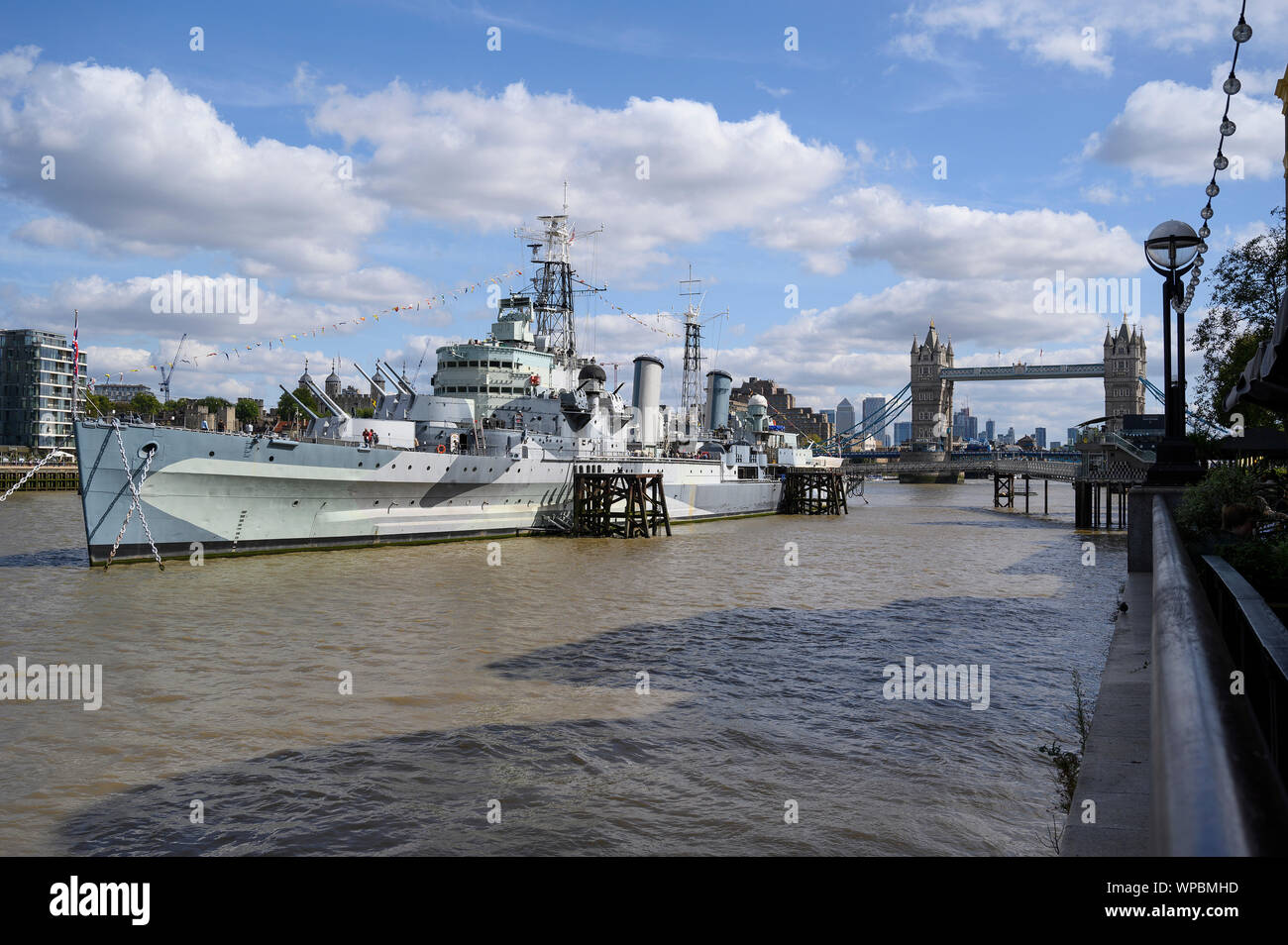 HMS Belfast on the river Thames with Tower Bridge in the background ...