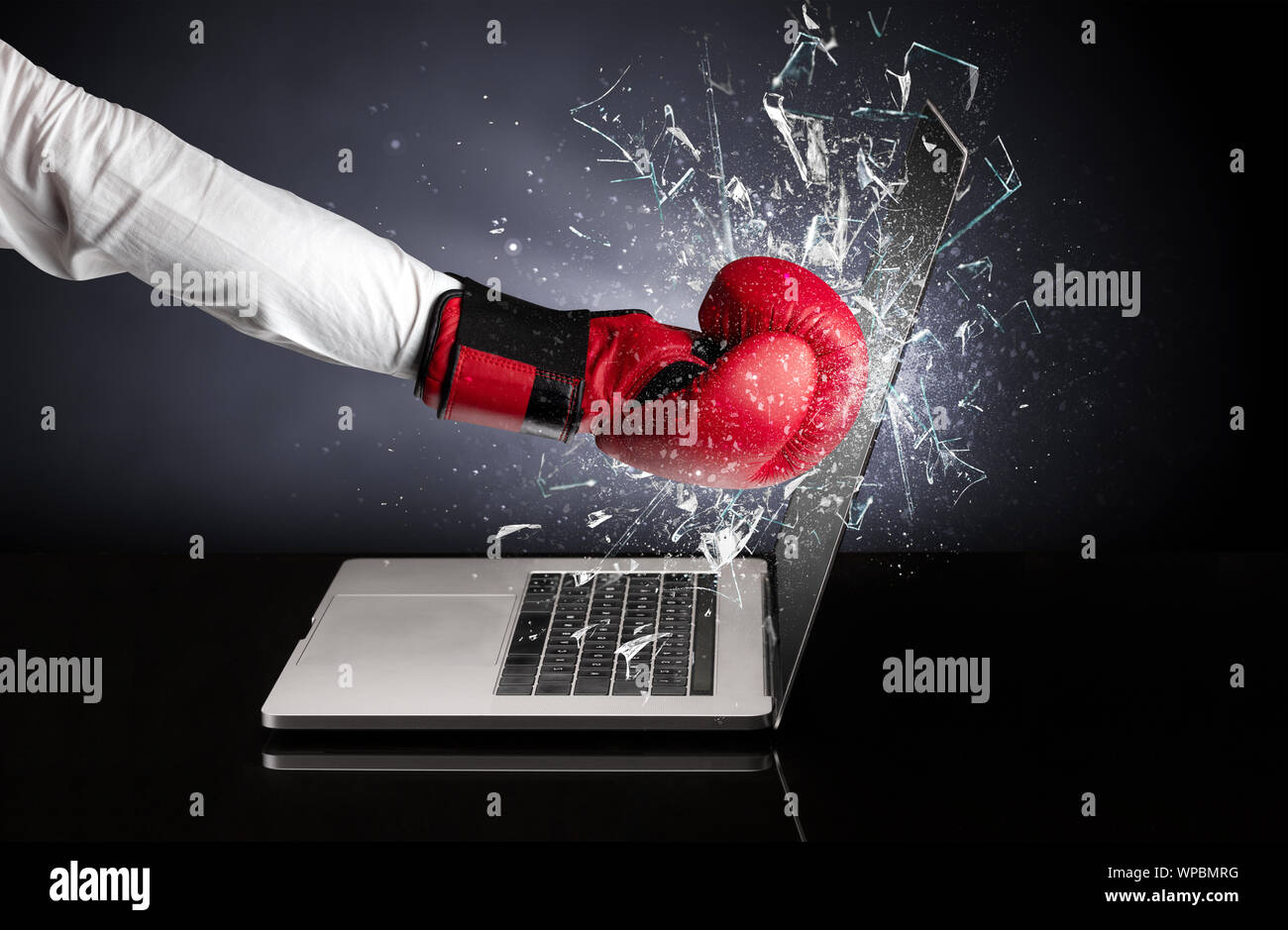 Hand hitting strongly laptop screen glass Stock Photo - Alamy