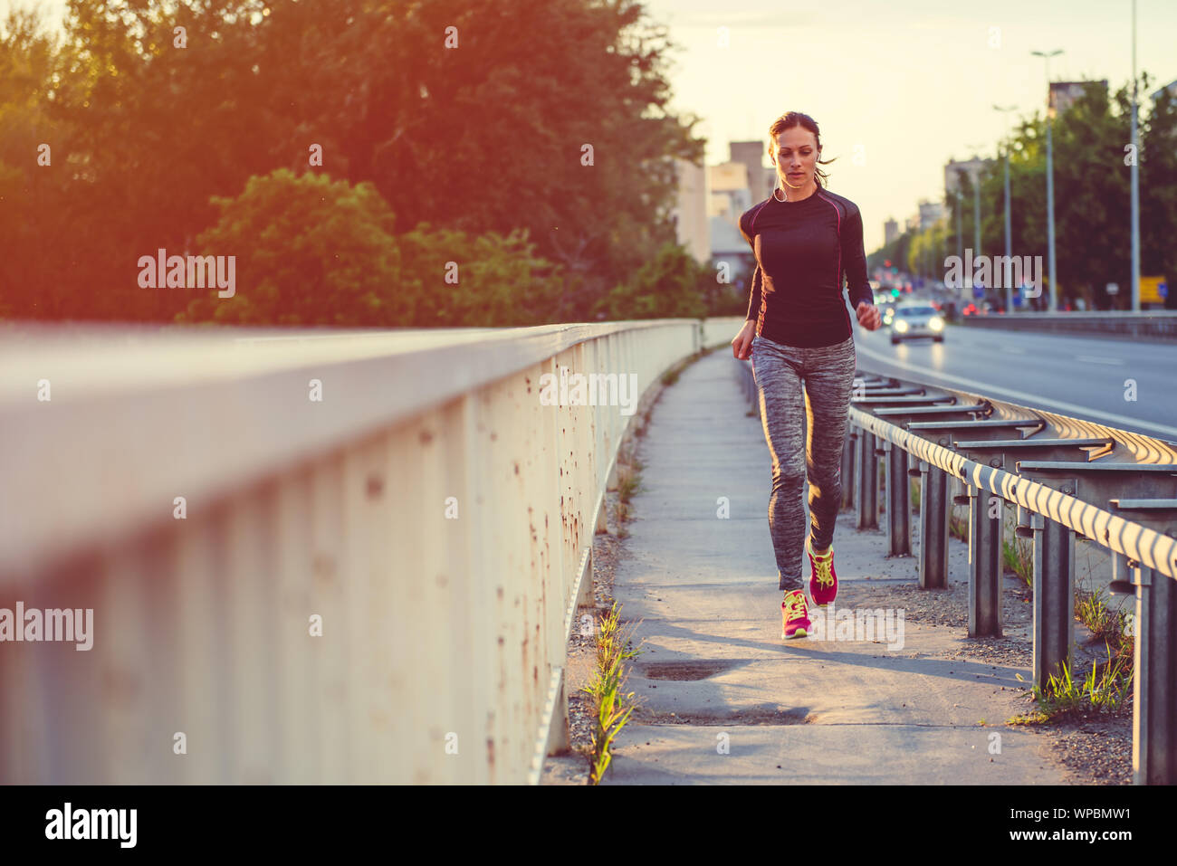 Women running in the city Stock Photo - Alamy