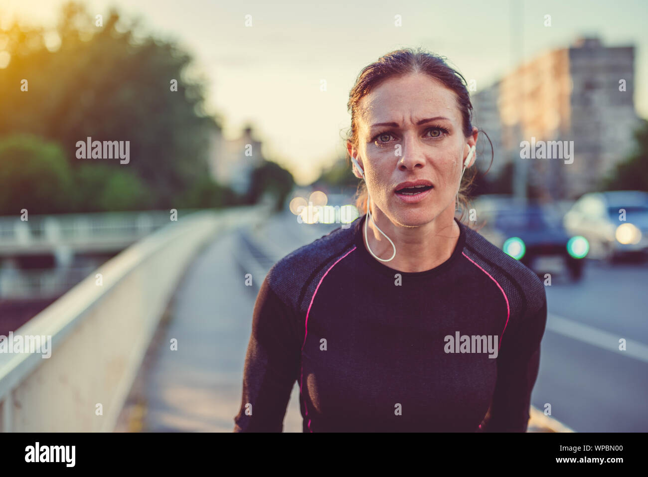 Portrait of confused fitness women Stock Photo - Alamy