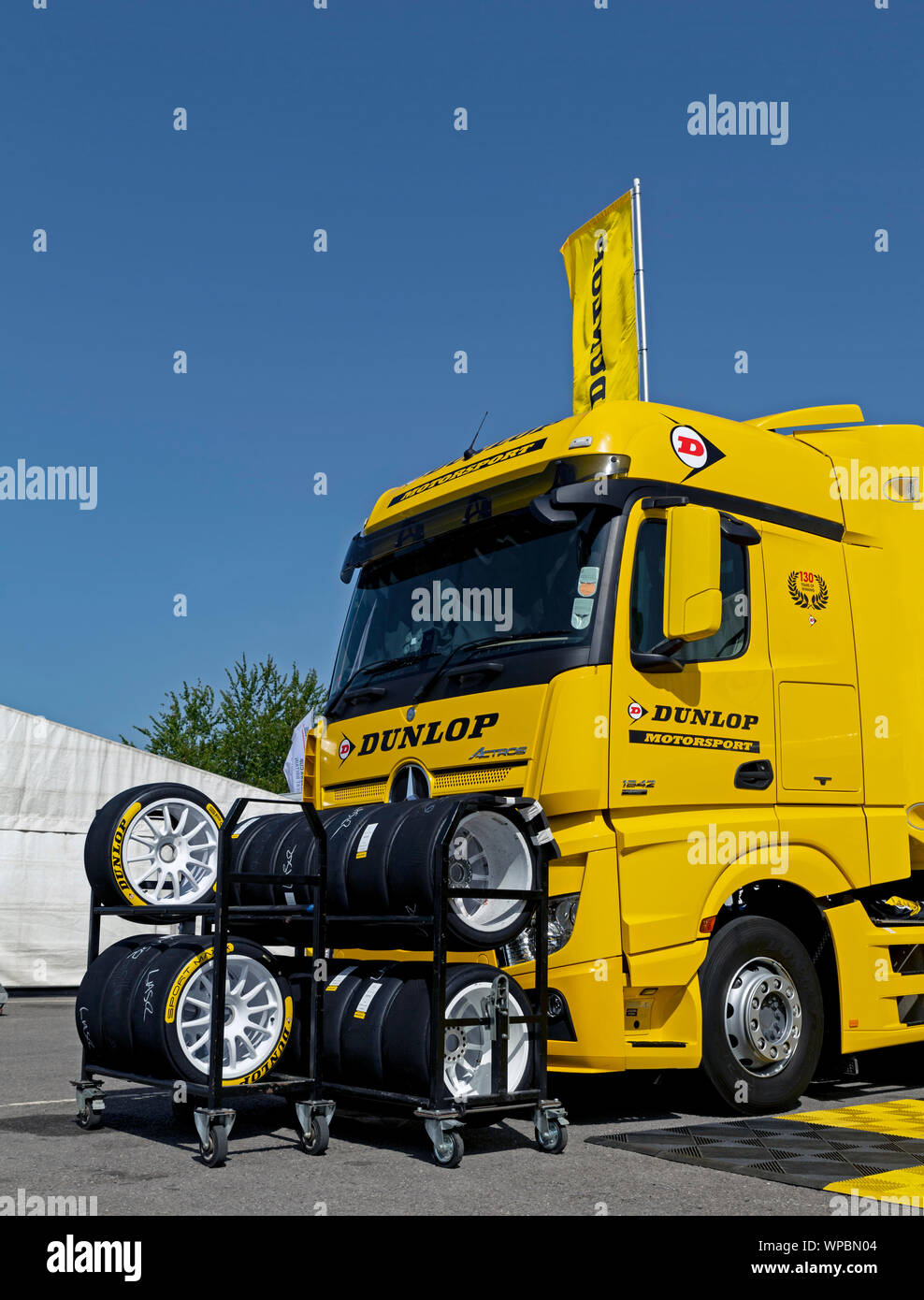 Oulton Park paddock area, Dunlop truck and tyre stand Stock Photo - Alamy