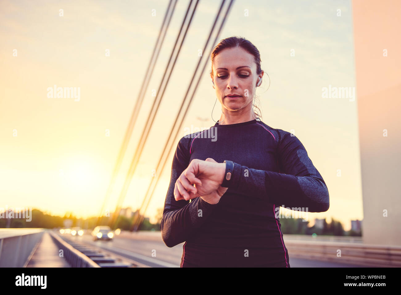 Woman monitoring her progress on smart watch Stock Photo - Alamy