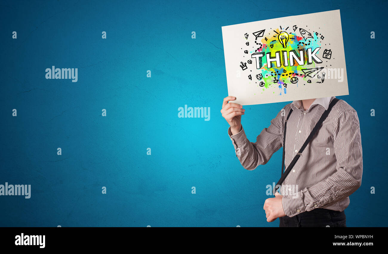 Young person holding paper with design thinking concept Stock Photo - Alamy