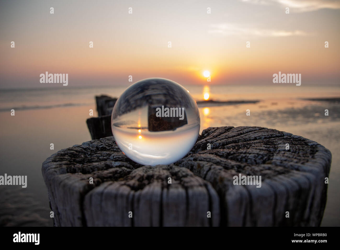 Glass ball pictures taken at the beach at sunset in Hollum, Ameland ...