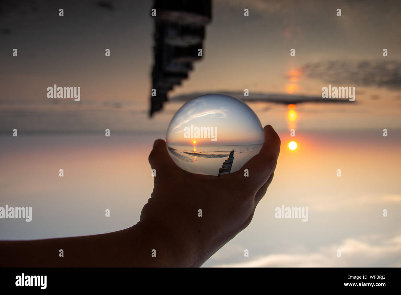 Glass ball pictures taken at the beach at sunset in Hollum, Ameland ...