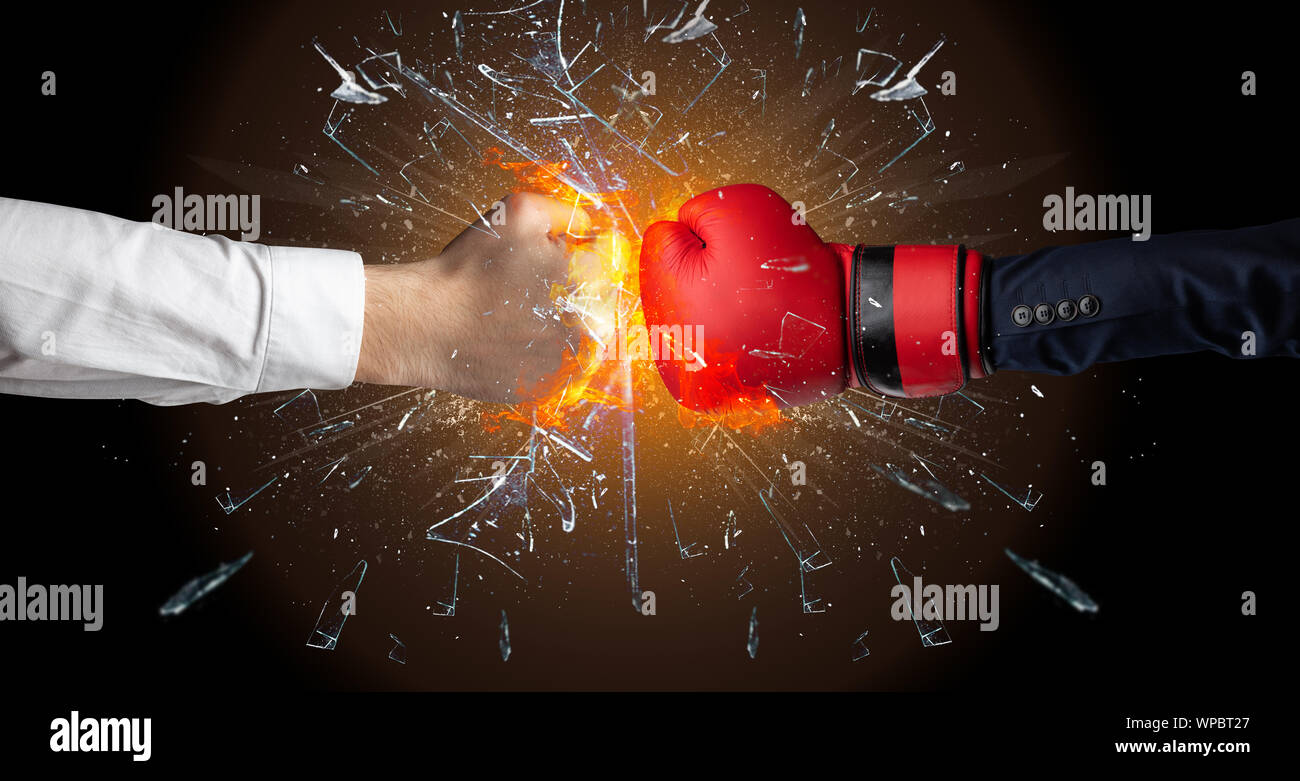 Two hands fighting and breaking a glass into small pieces Stock Photo ...
