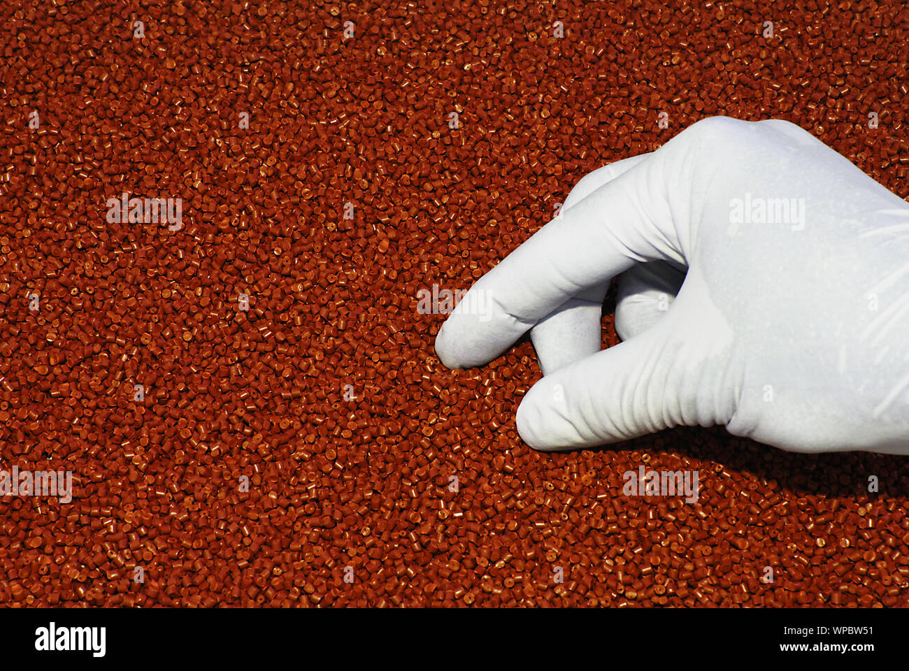 Chemistry checking polymer granulate in laboratory Stock Photo - Alamy