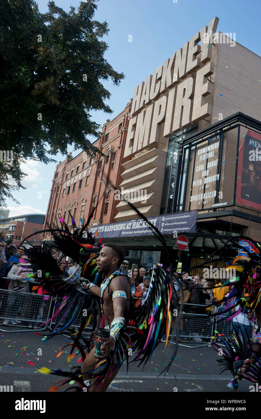 Dancers and musicians on parade enjoying Hackney Carnival in the streets of Hackney, London ...