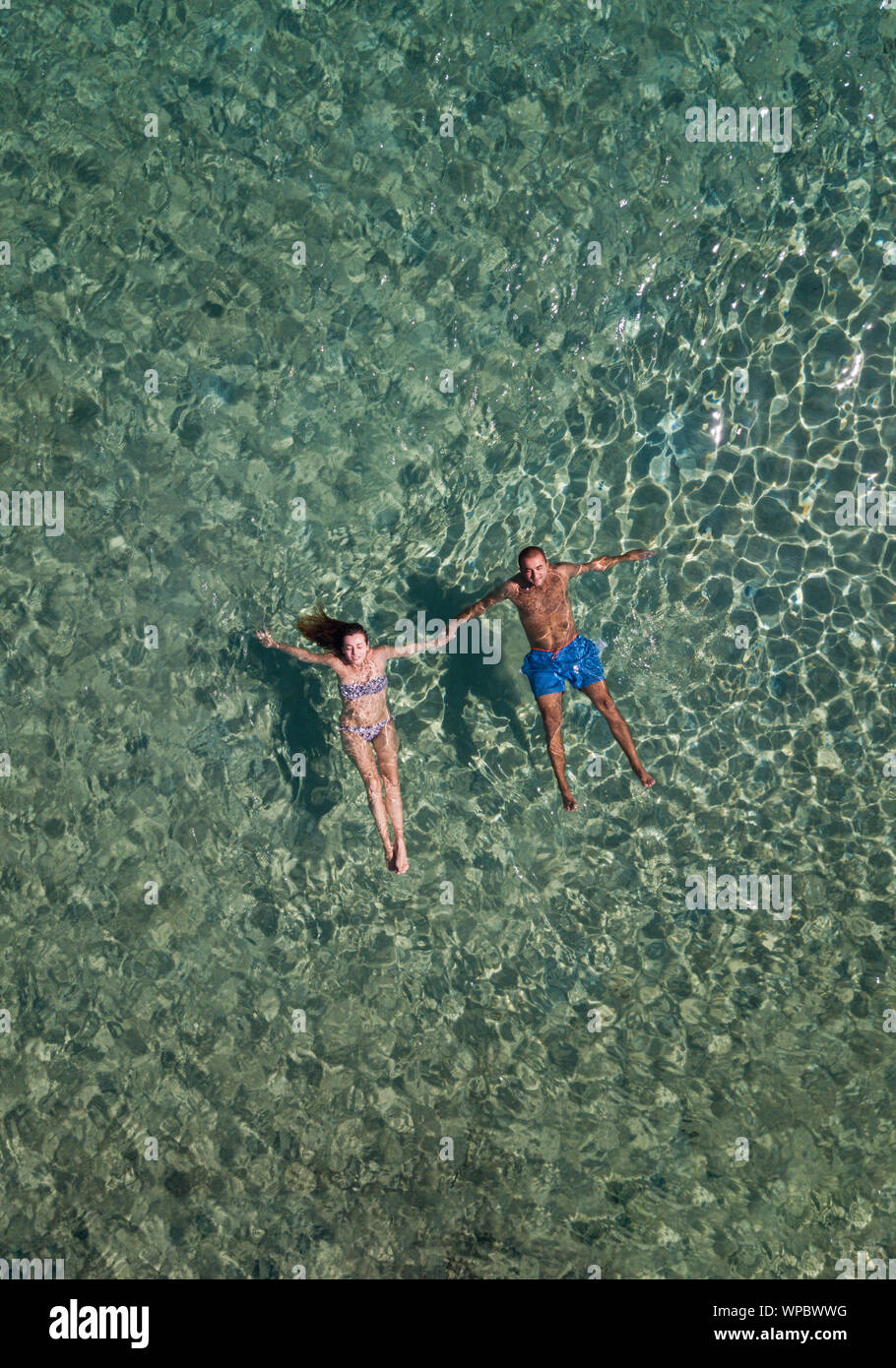 Cute couple floating in the sea aerial Stock Photo - Alamy