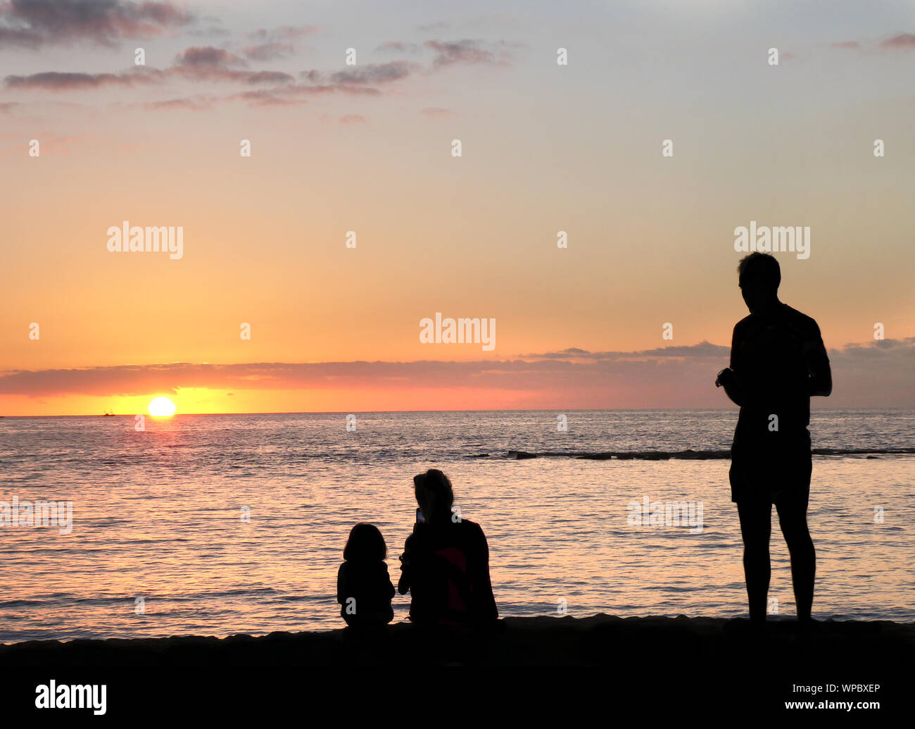 Family watching sunset on Fanabe beach, Costa Adeje, Tenerife Stock ...