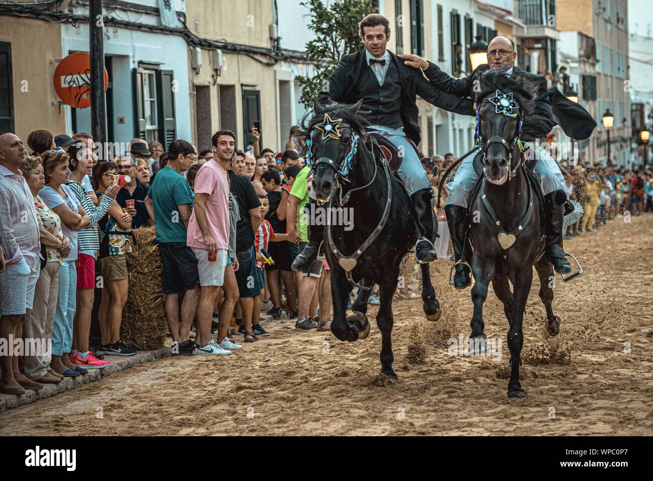 Mahon, Spain. 8th Sep, 2019. 'Caixers' (horse riders) ride in between ...