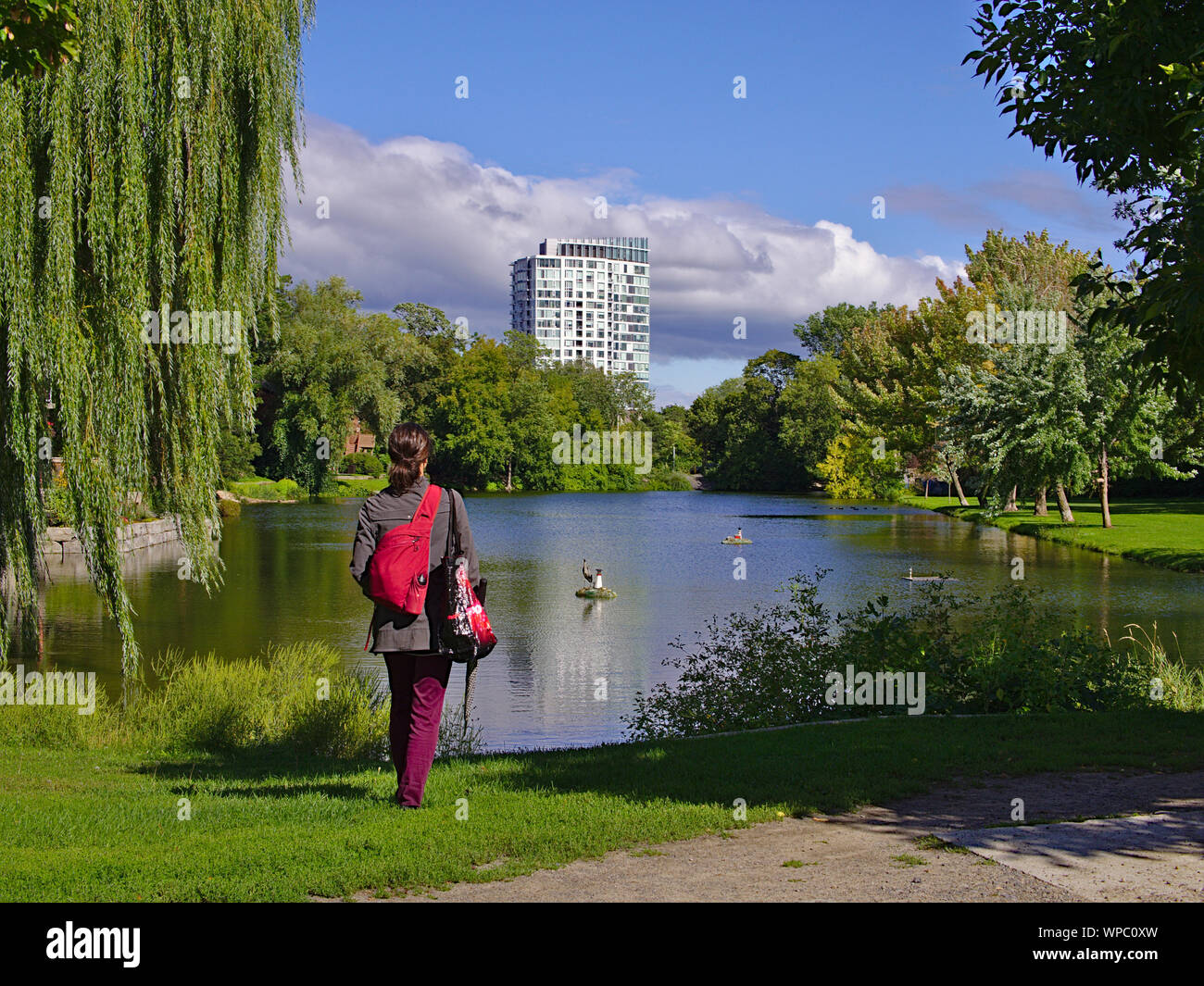 A woman with a red backpack approaches Brown's Inlet, Ottawa, Ontario ...