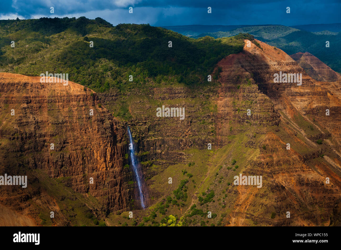 Overlooking Waimea Falls in Waimea Canyon State Park on the island of ...