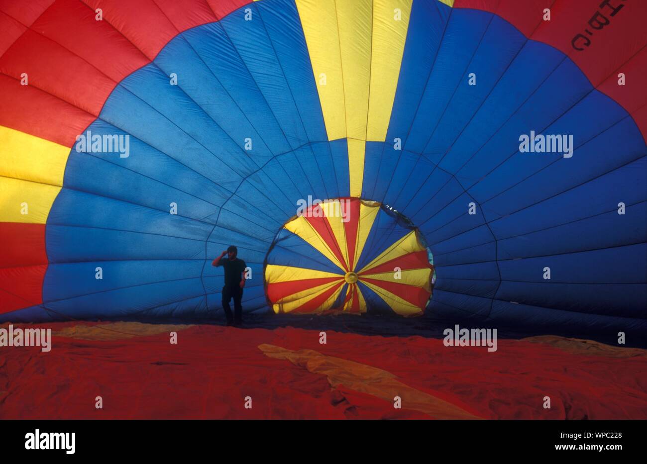 Male standing inside of an air balloon Stock Photo - Alamy