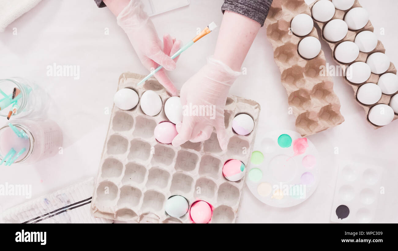 Flat lay. Painting craft Easter eggs with acrilic paint Stock Photo - Alamy