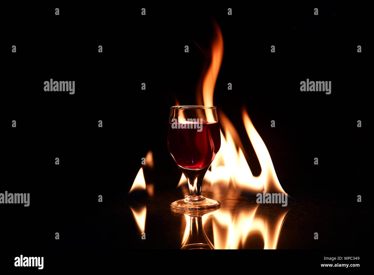 Red drink fire behind hi-res stock photography and images - Alamy
