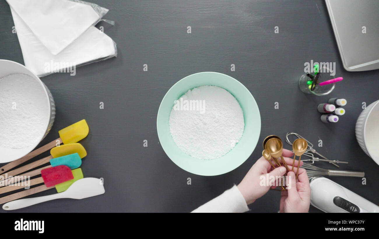 Step by step. Flat lay. Preparing simple royal icing to decorate sugar ...