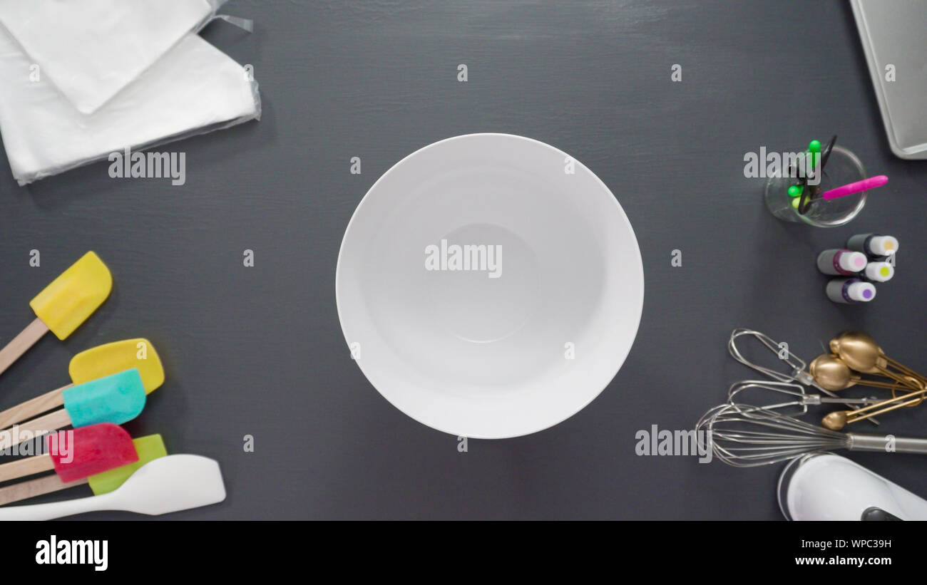 Step by step. Flat lay. Preparing simple royal icing to decorate sugar ...