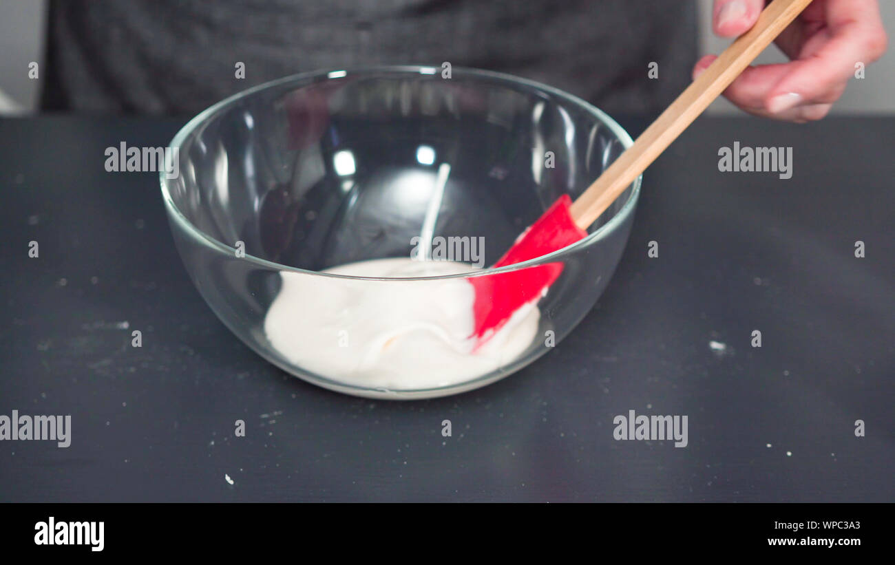 Step by step. Mixing in food coloring into the royal icing to decorate ...