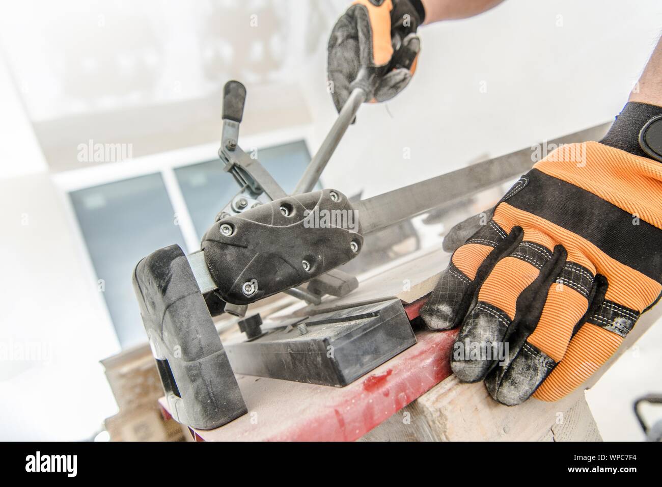Tile Cutter Industry Equipment. Construction Worker Trimming Ceramic ...