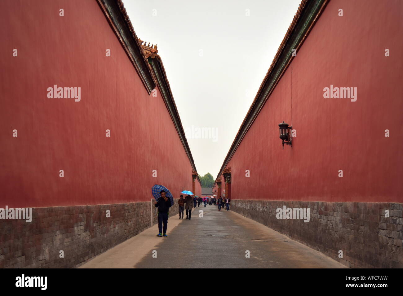 Chinese inner alleys and red walls in Forbidden City palace complex ...