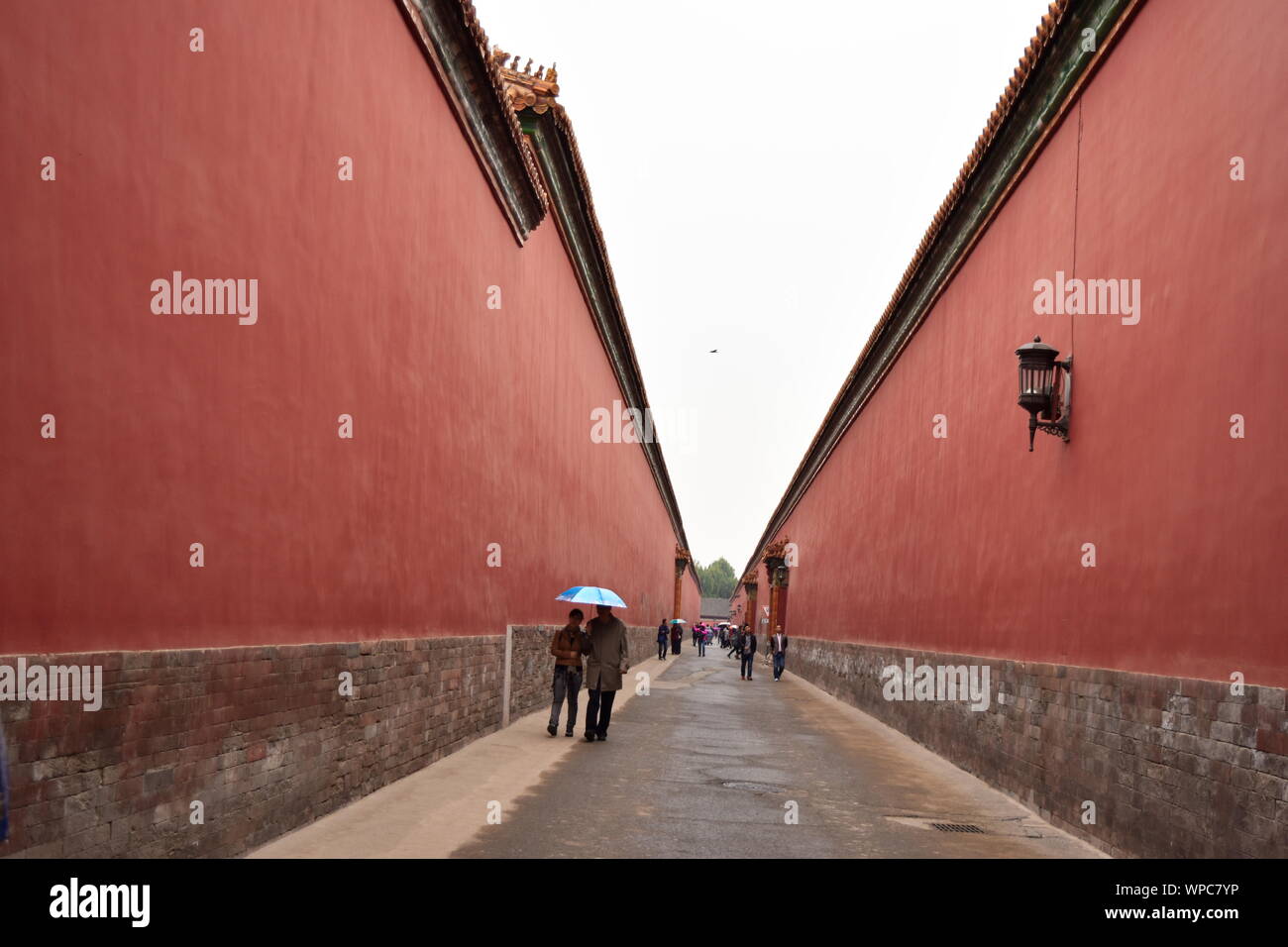 Chinese inner alleys and red walls in Forbidden City palace complex ...
