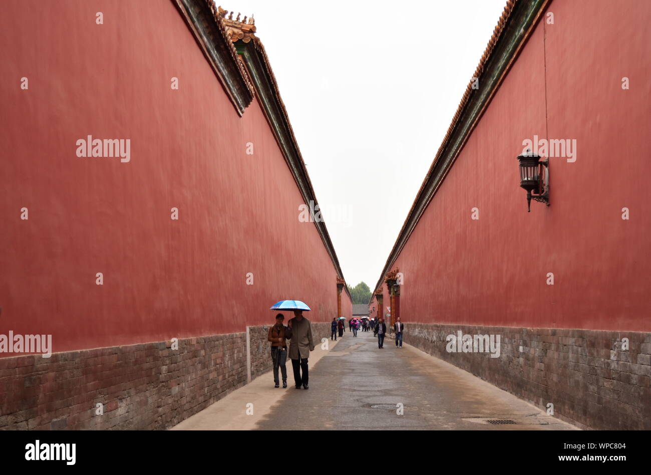 Chinese inner alleys and red walls in Forbidden City palace complex ...