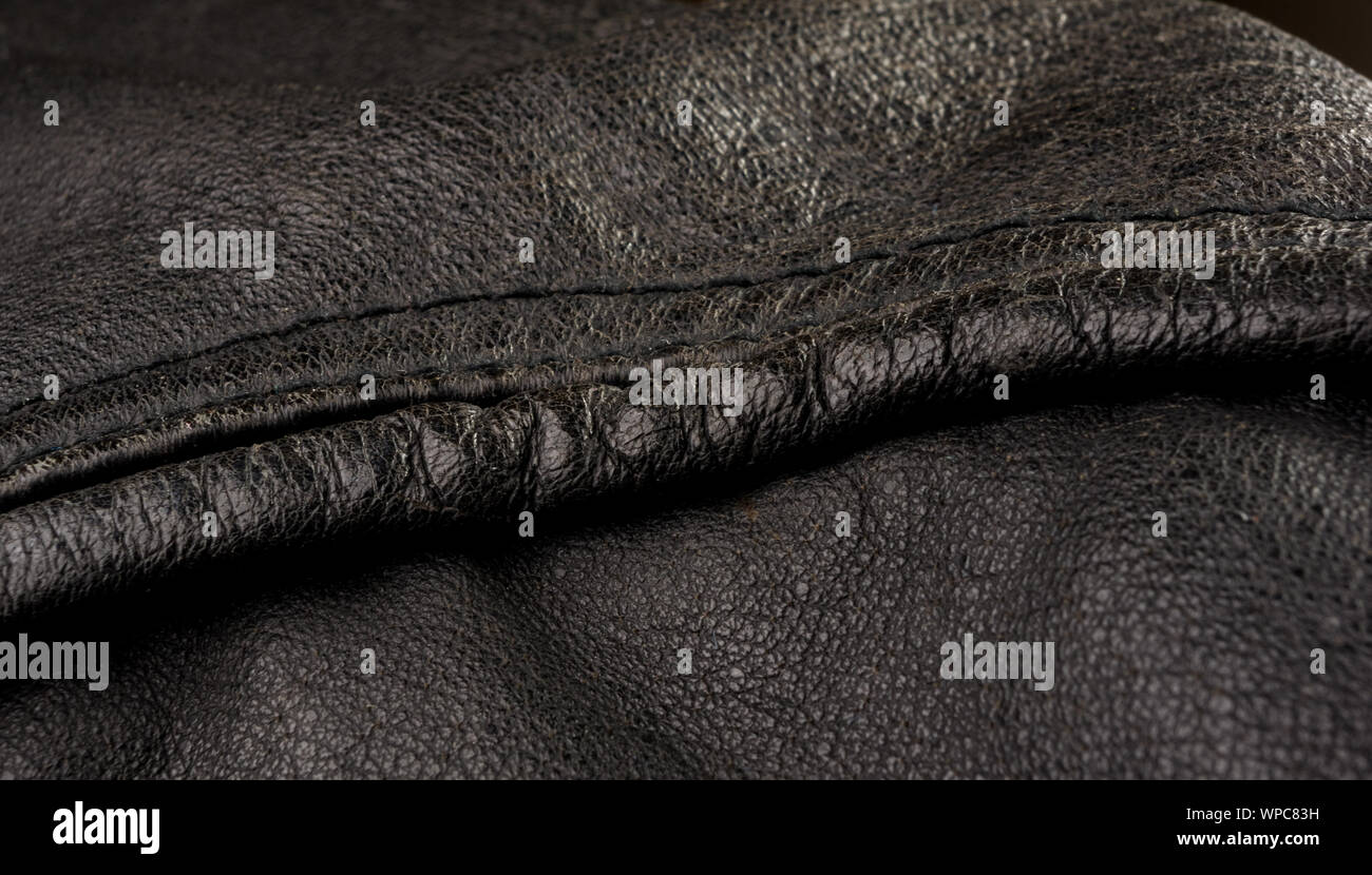 Old vintage genuine soft black leather texture background, top layer ...