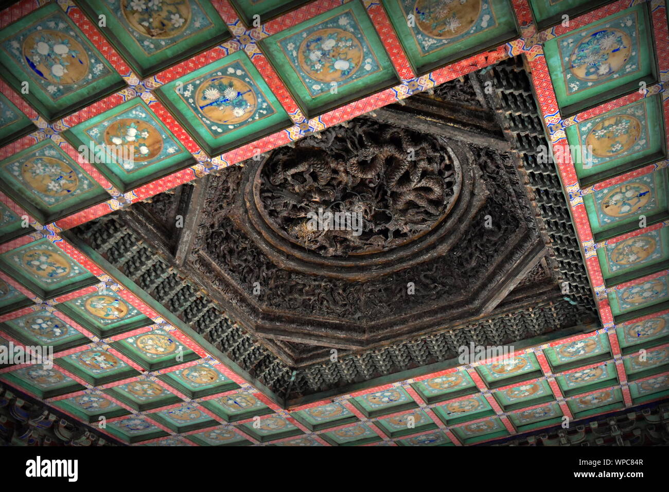 Old Chinese wooden dragon and beautifully colored ceiling of Fubi ...