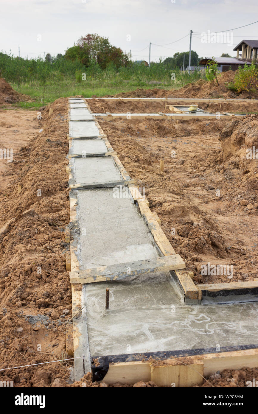 The formwork of the foundation of the future house is strengthened and ...