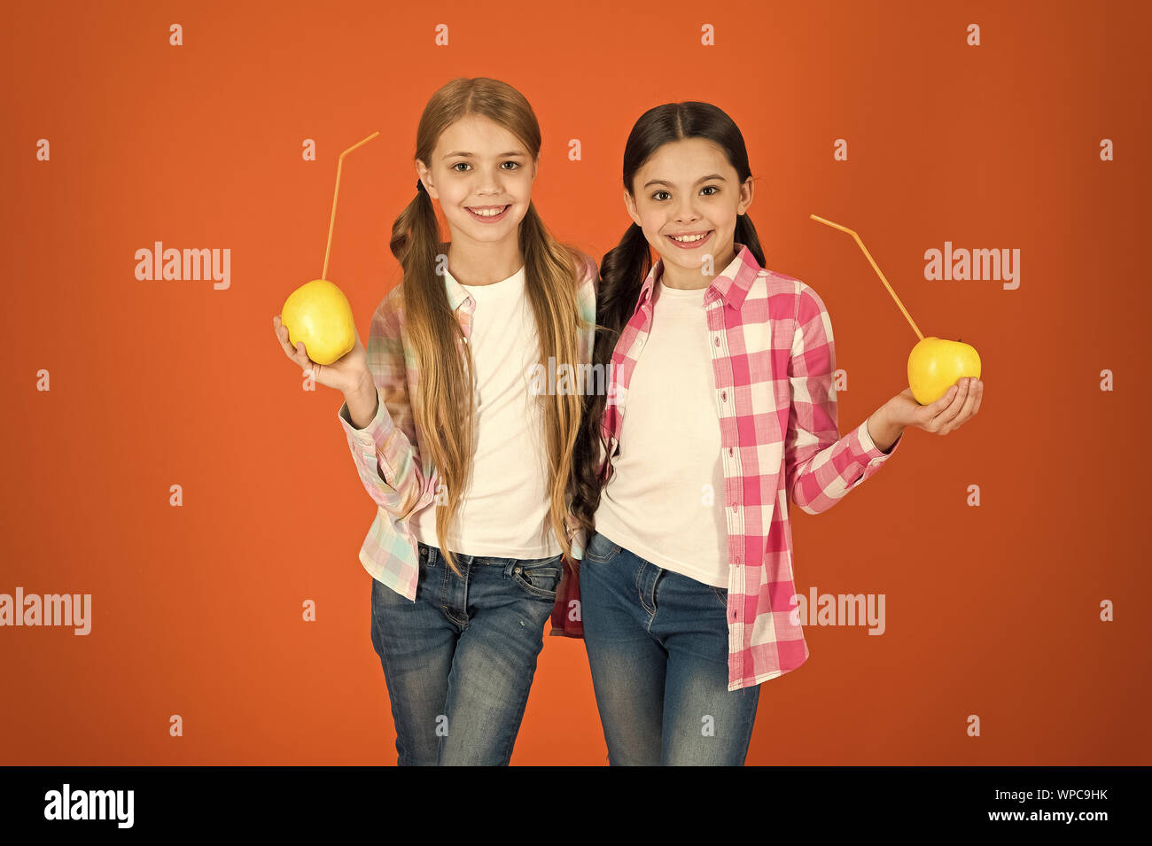 Distributing free fresh fruit at school. Girls kids casual style eat ...