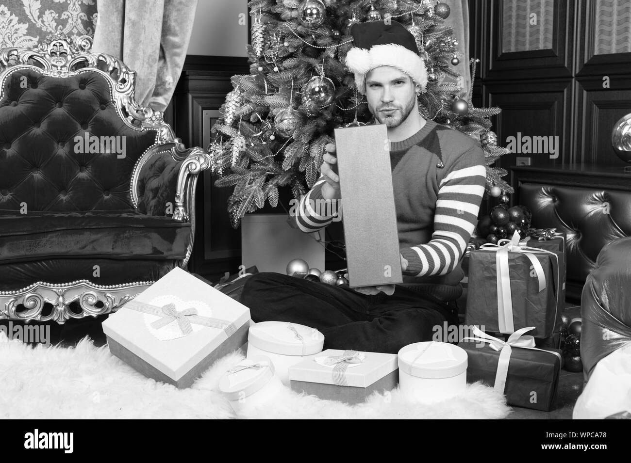 Christmas preparation man celebrating Black and White Stock Photos ...