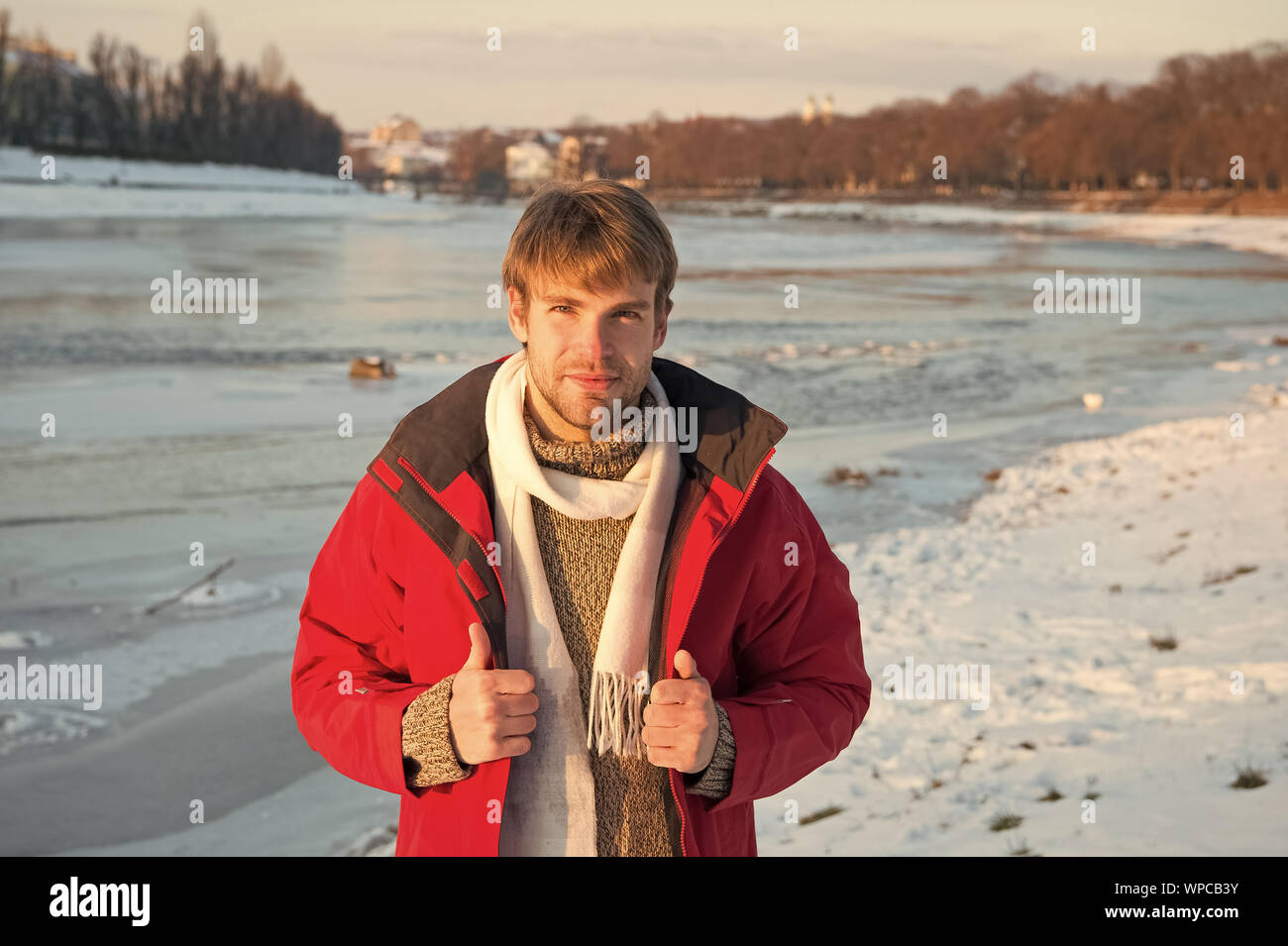 Clothes for winter walks. Hipster winter warm outfit. Guy wear jacket ...
