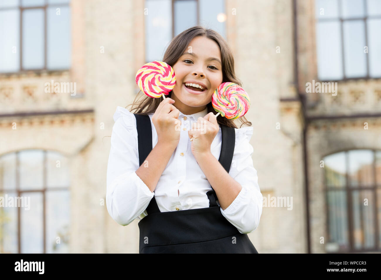Crazy about sweets. Happy kid with candy. School nutrition. Calories ...