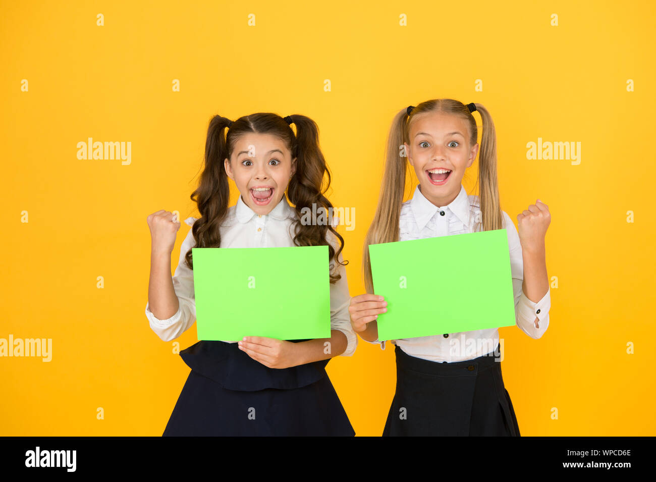 Homework done. Happy small children holding empty homework sheets on ...