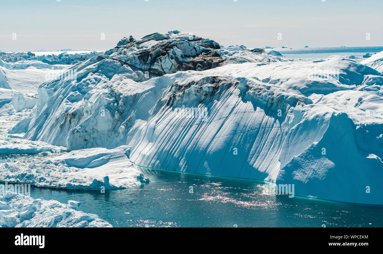 Iceberg and ice from glacier in arctic nature landscape on Greenland ...