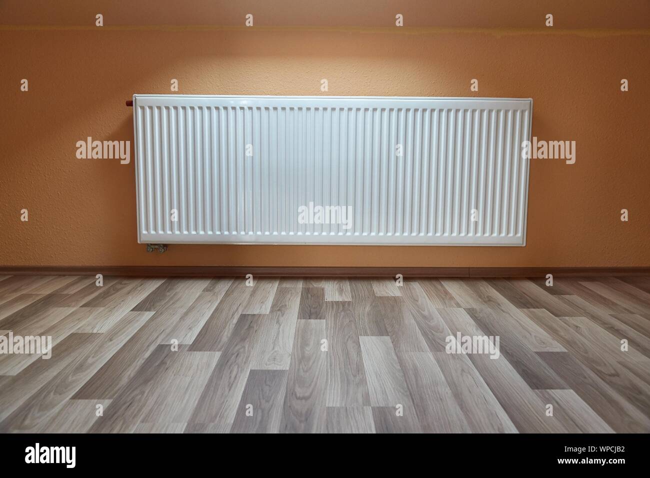 Heating Radiator in a Room Stock Photo - Alamy