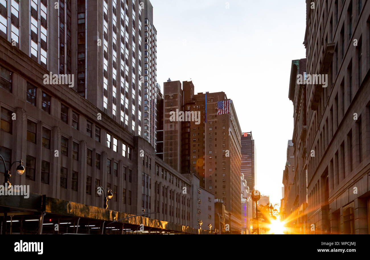 Sunlight shines between the buildings along 34th Street in Midtown ...